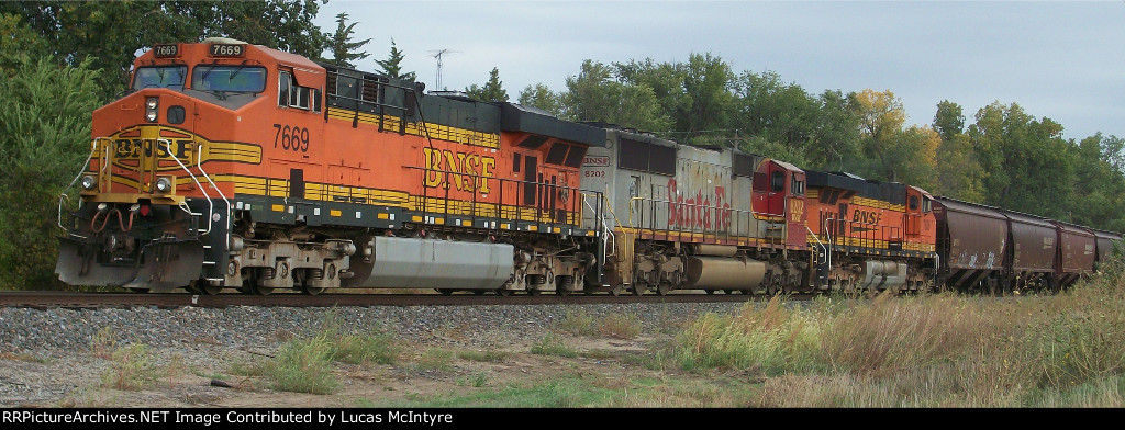 BNSF 7669 tied down eastbound BNSF loaded grain train